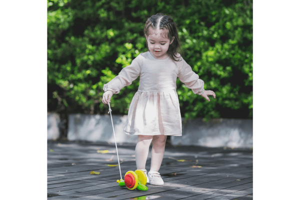 Plan Toys Pull Along Snail I The Montessori Room